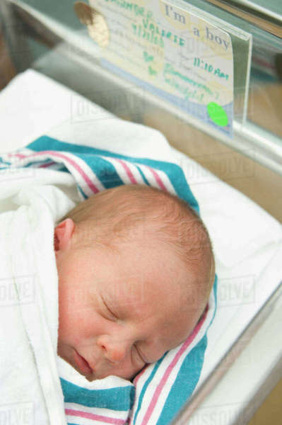 Newborn baby in hospital bed - Royalty-free Stock Photo | Dissolve