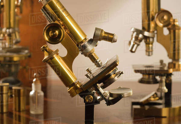 Old fashioned microscopes on table - Royalty-free Stock Photo | Dissolve