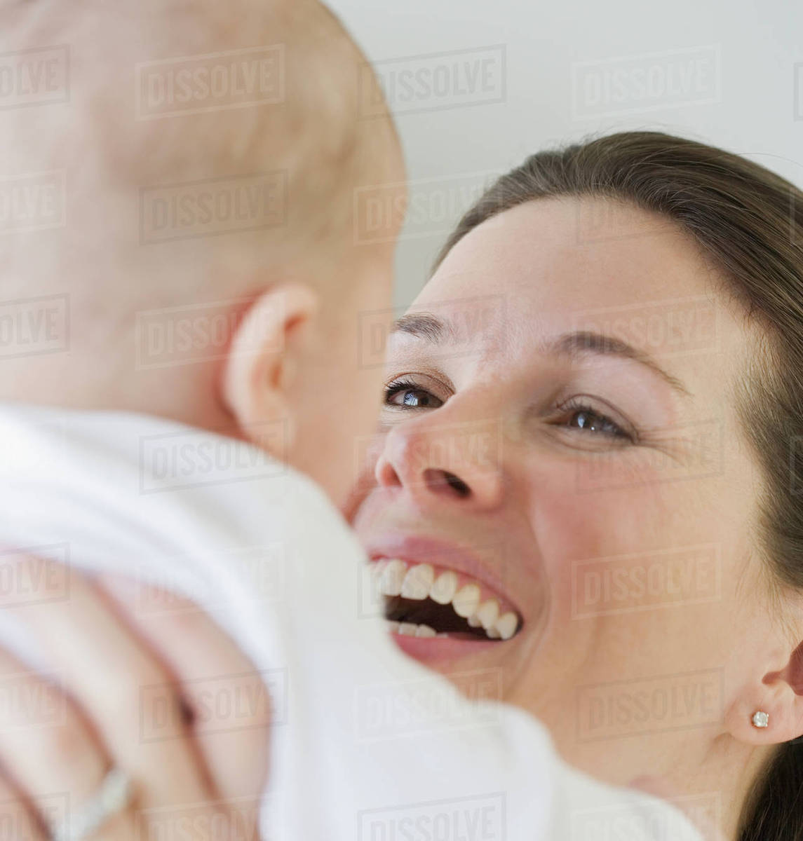 Mother laughing at baby - Stock Photo - Dissolve