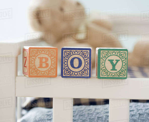 Boy spelled out with blocks on crib - Royalty-free Stock Photo | Dissolve