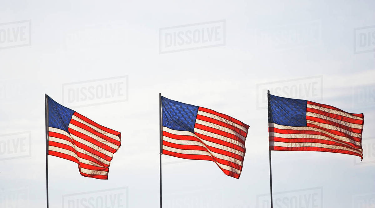 Row of American flags - Royalty-free Stock Photo | Dissolve