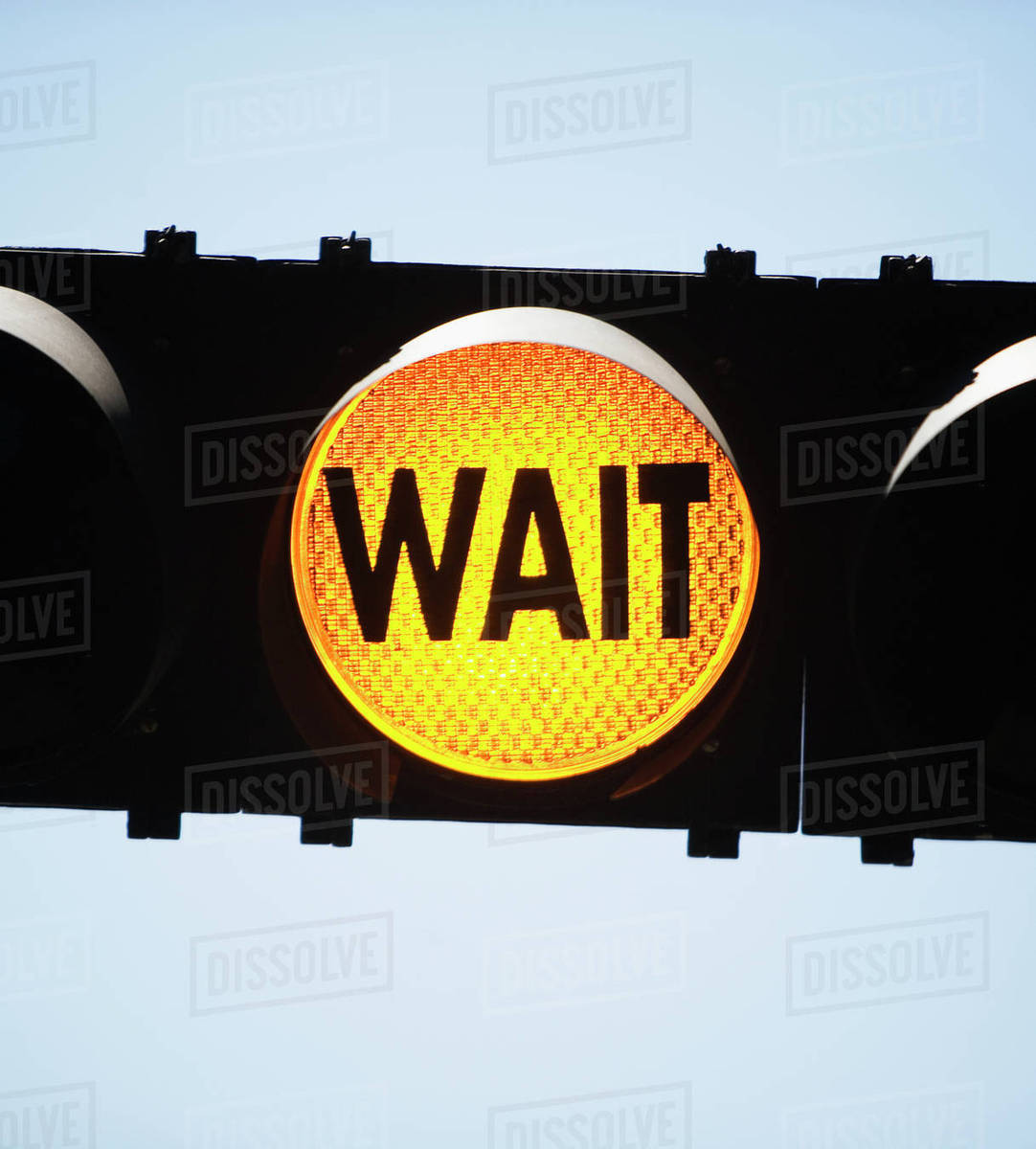 Yellow traffic light reading Wait - Royalty-free Stock Photo | Dissolve