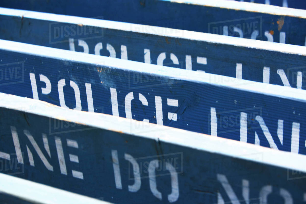 Row of Police Line barriers - Royalty-free Stock Photo | Dissolve