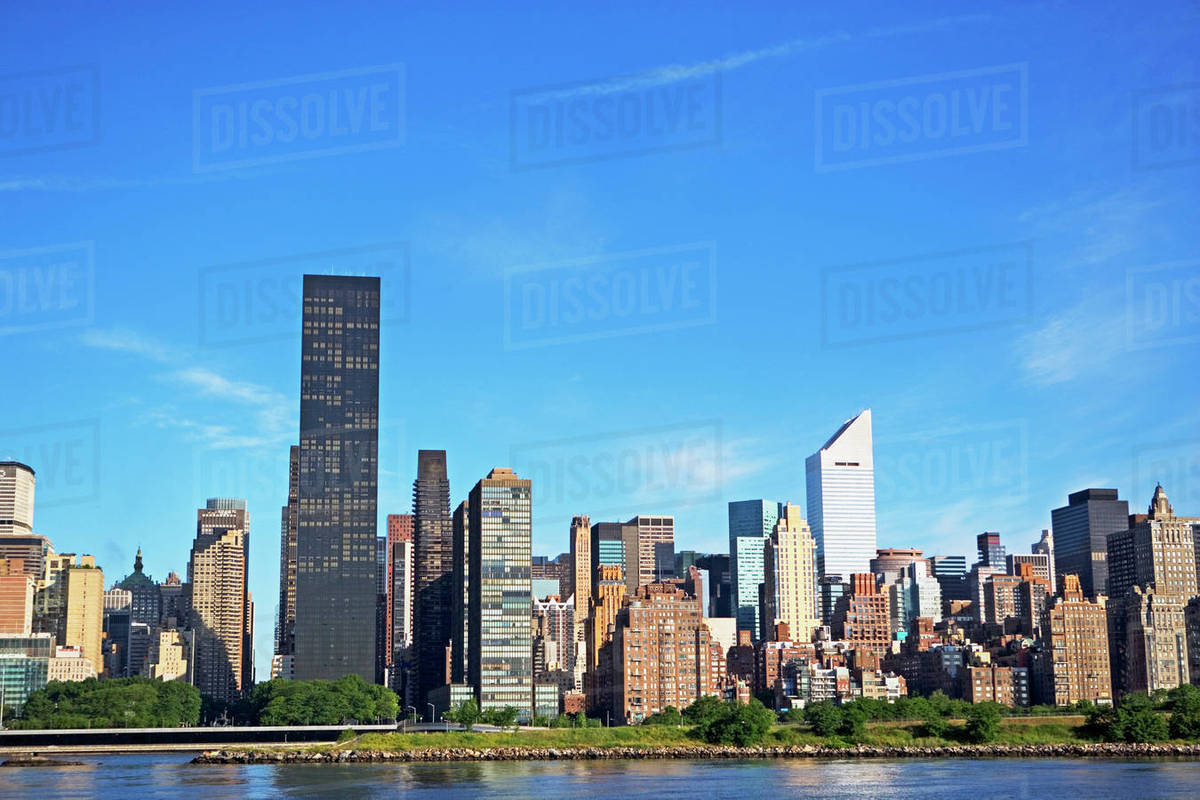 New York City skyline under blue sky - Royalty-free Stock Photo | Dissolve
