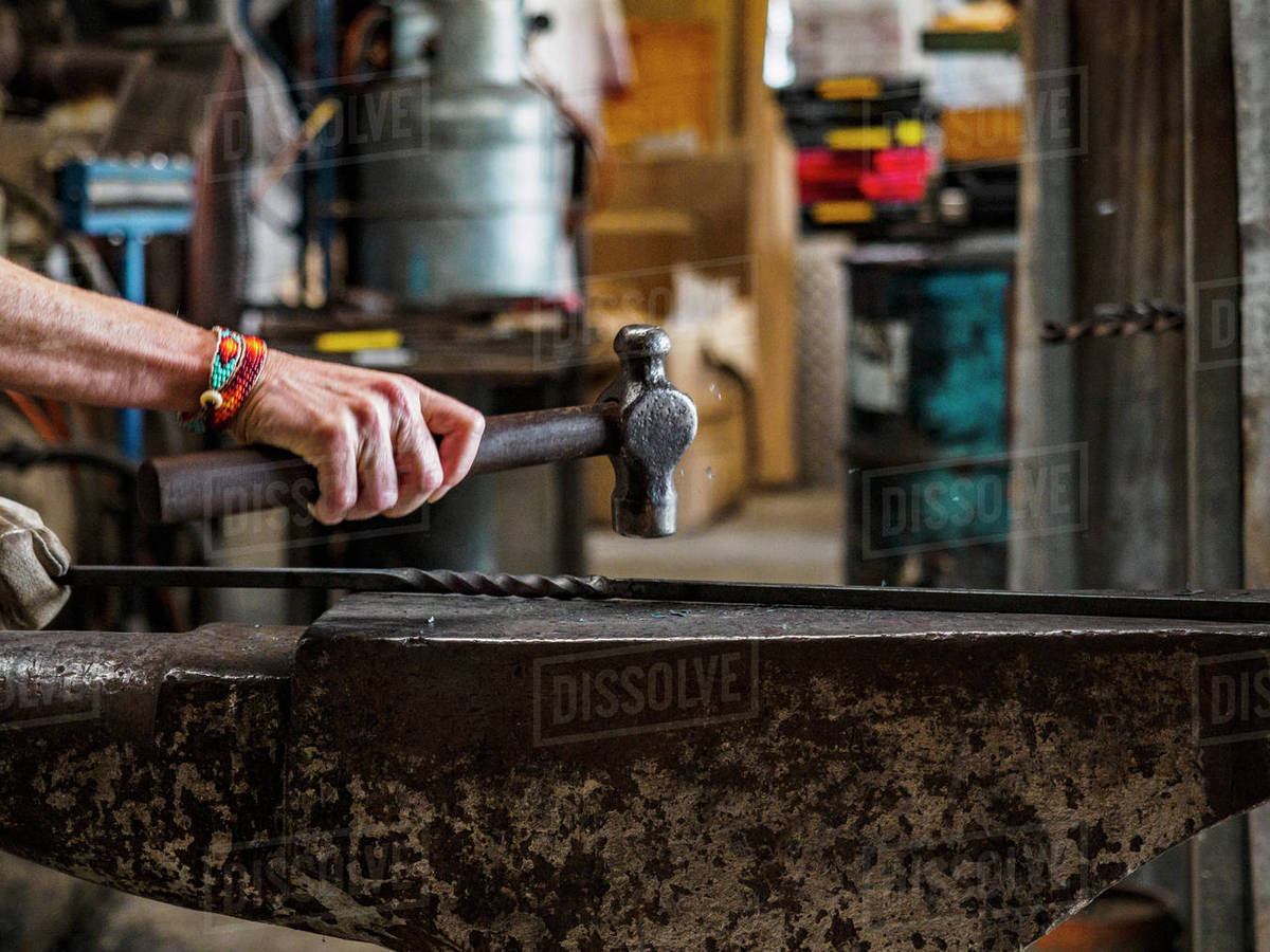 Close up of hand of female blacksmith at work - Royalty-free Stock ...