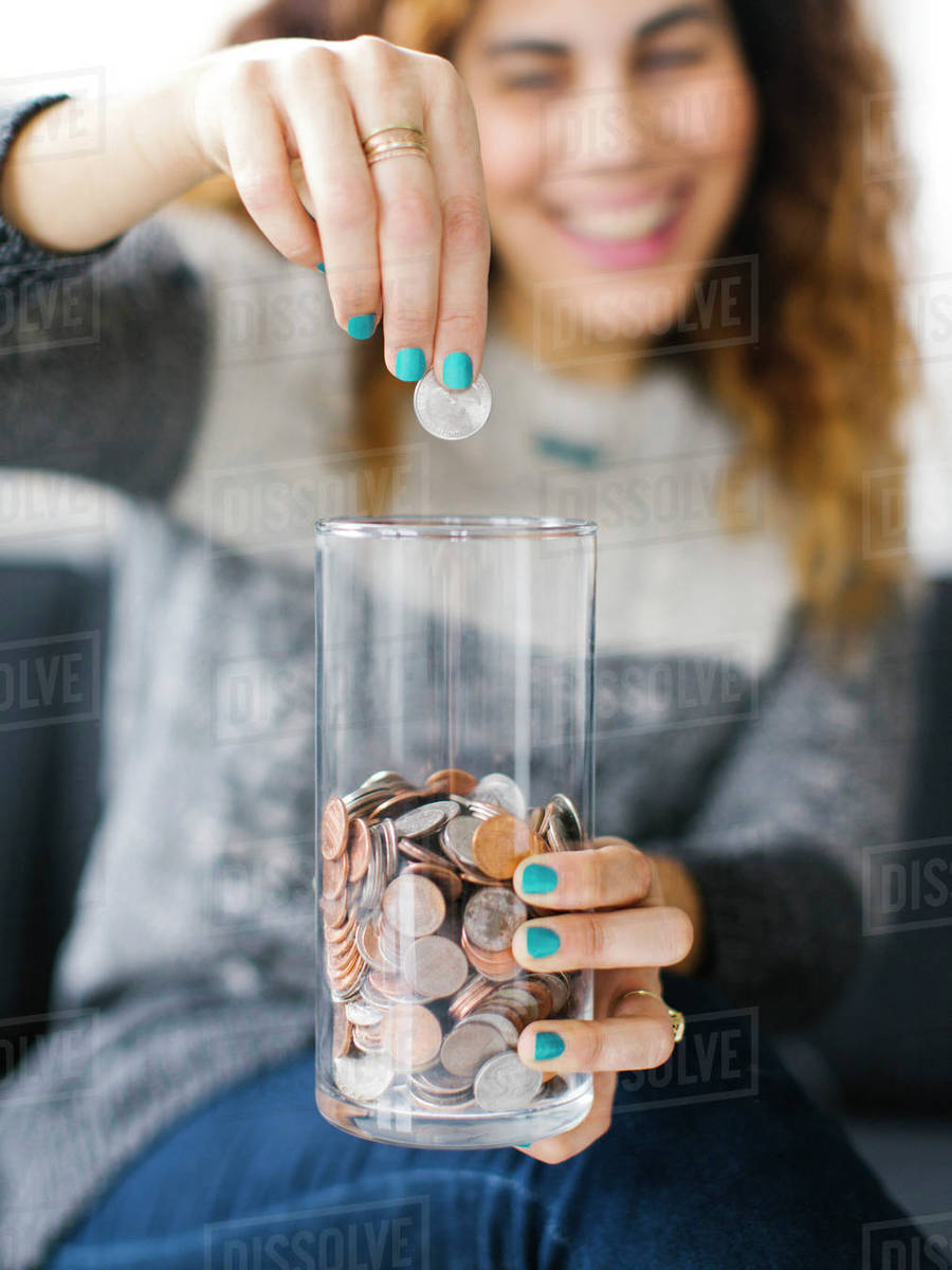 Woman saving money - Royalty-free Stock Photo | Dissolve