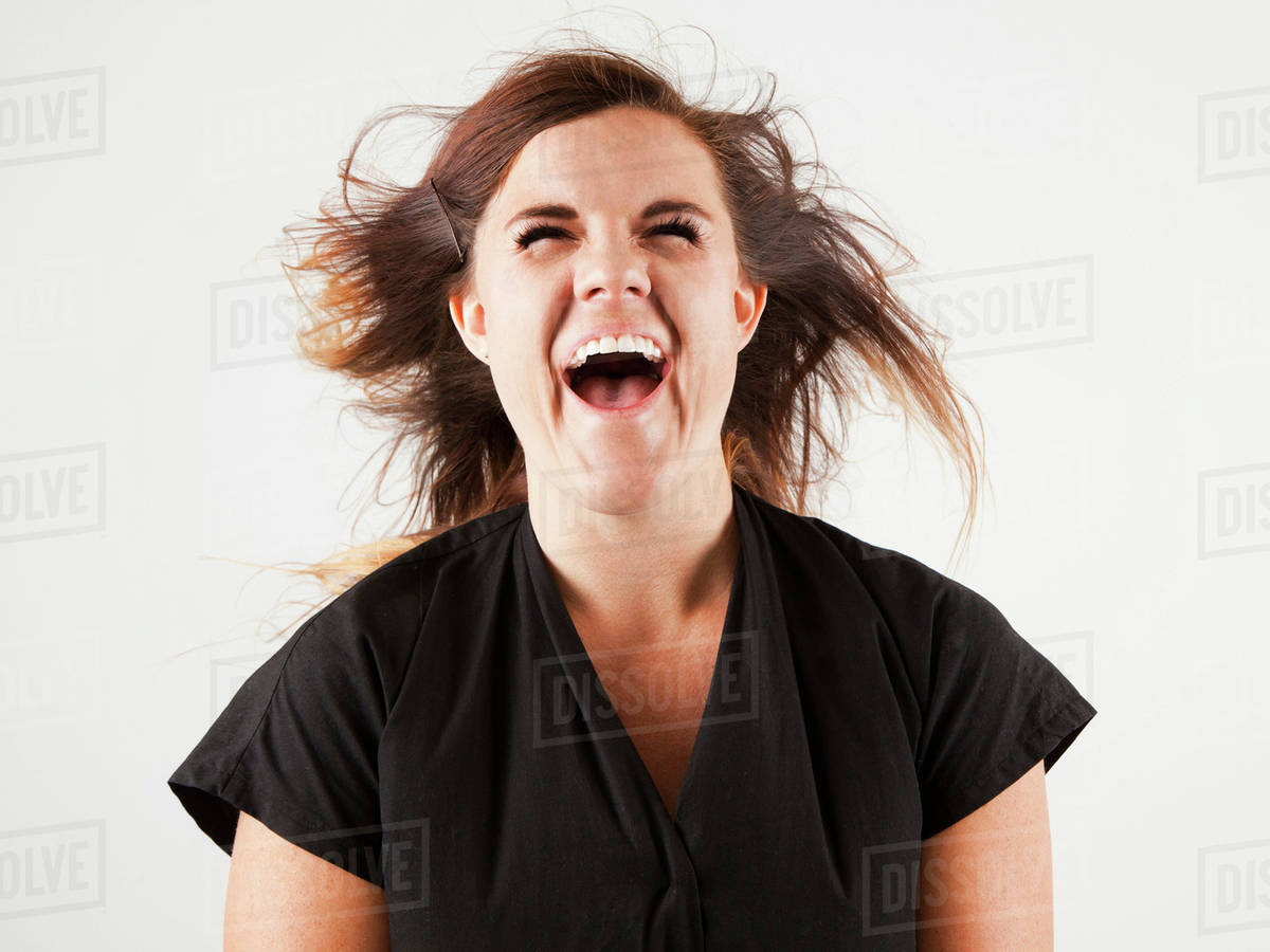 Studio portrait of young woman screaming - Royalty-free Stock Photo ...