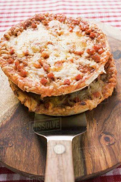 Two mini-pizzas with mince and cheese on server - Royalty-free Stock ...