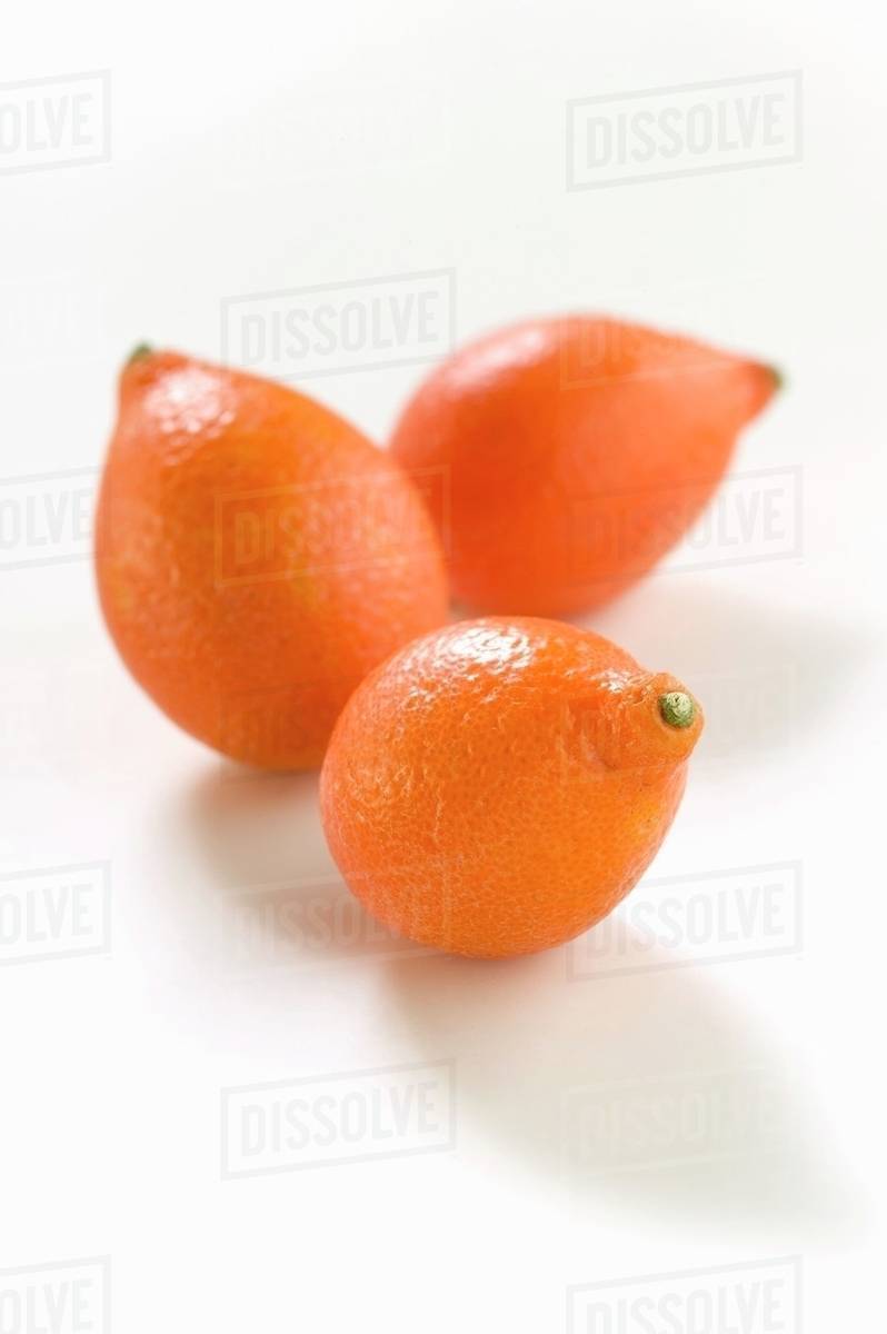 Three small oranges - Stock Photo - Dissolve