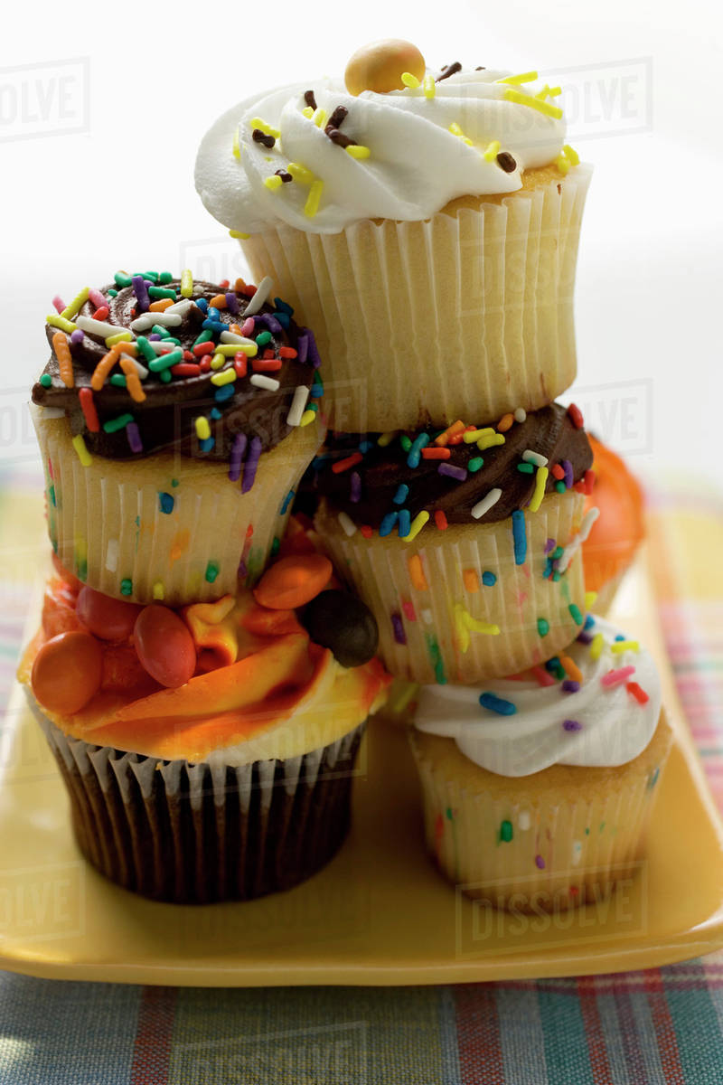 A pile of colourful decorated muffins - Royalty-free Stock Photo | Dissolve