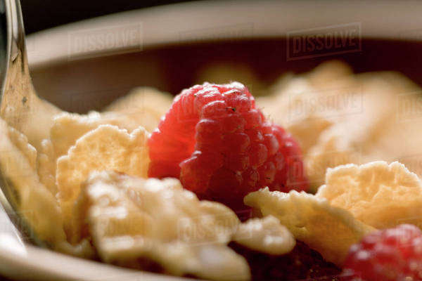 Flakes with raspberries, close-up - Royalty-free Stock Photo | Dissolve