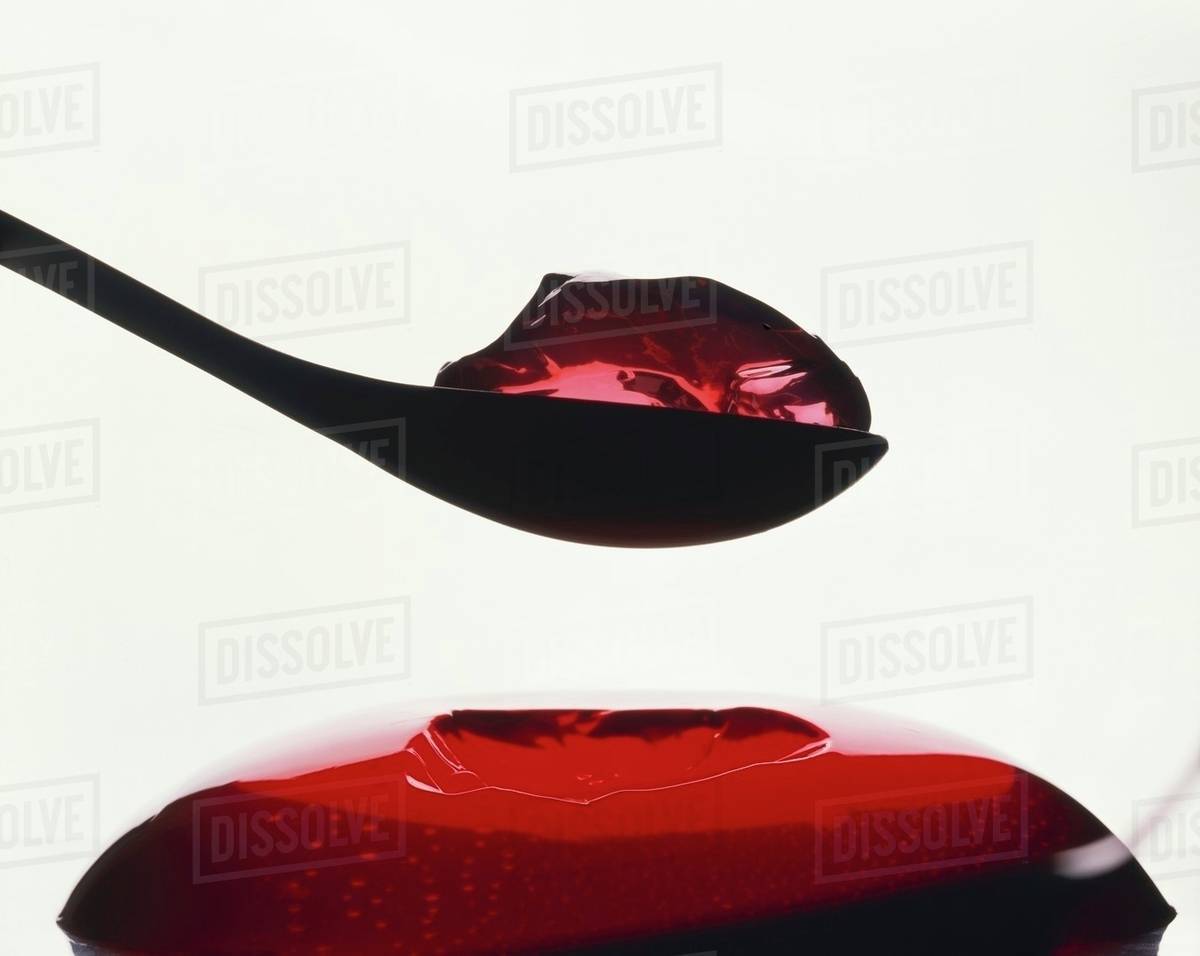 Red jelly with spoon - Royalty-free Stock Photo | Dissolve