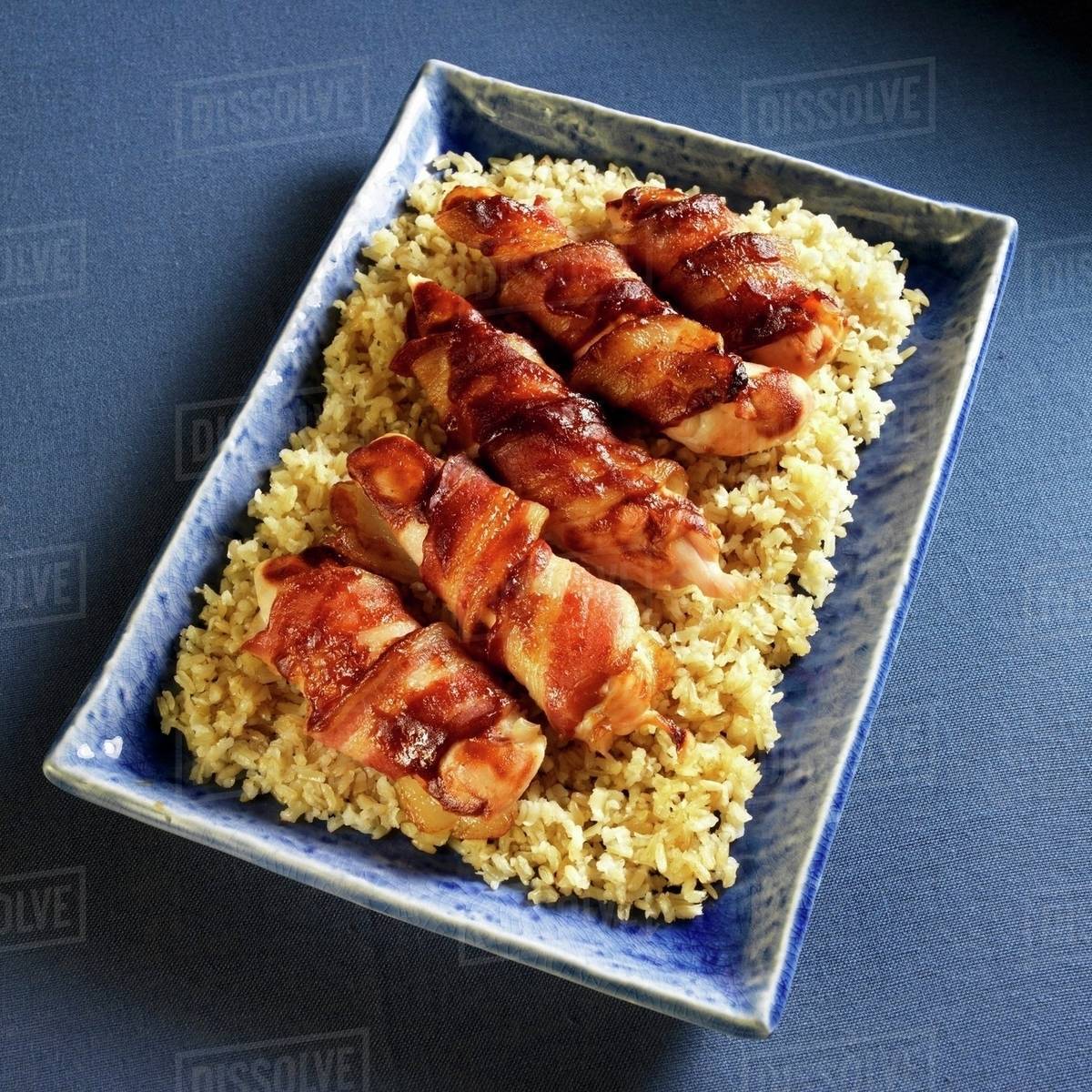 Barbecue Bacon Wrapped Chicken Tenders on a Bed of Rice - Royalty-free ...