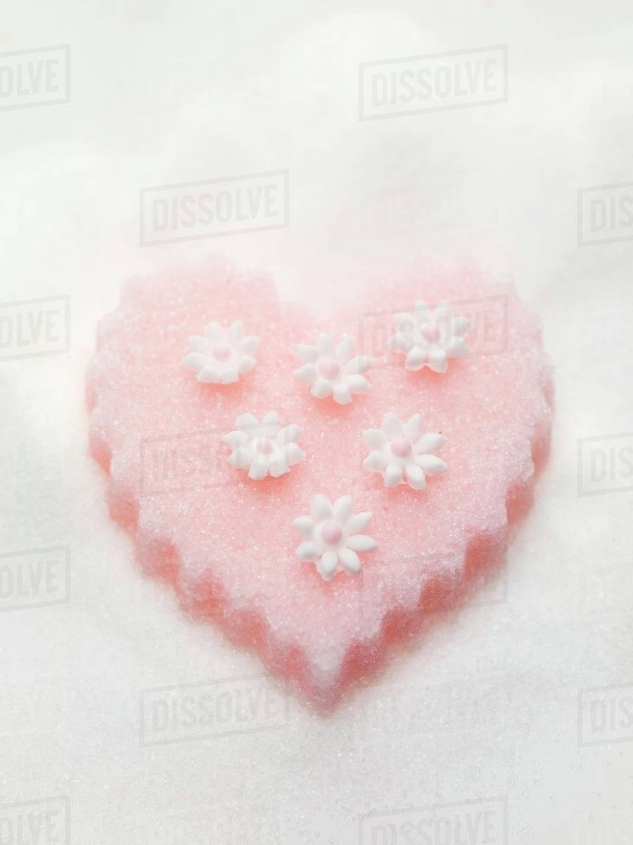 Pink sugar heart with flowers - Stock Photo - Dissolve