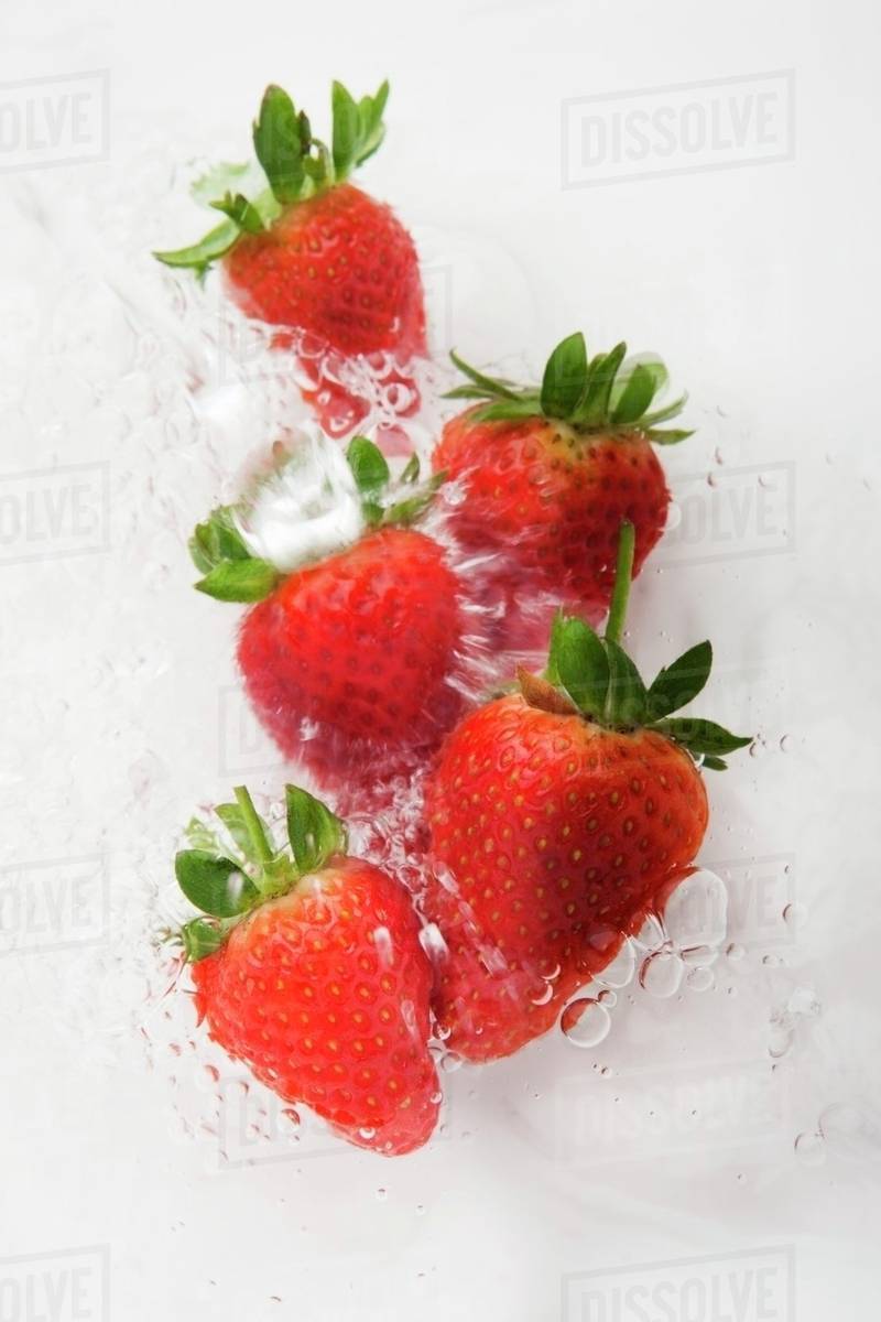 Strawberries in water - Royalty-free Stock Photo | Dissolve
