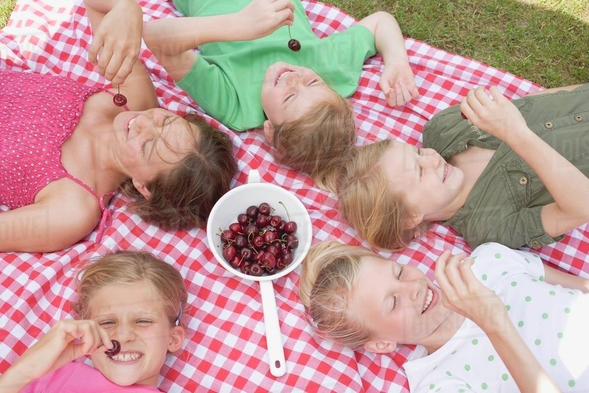 Children eating cherries - Royalty-free Stock Photo | Dissolve