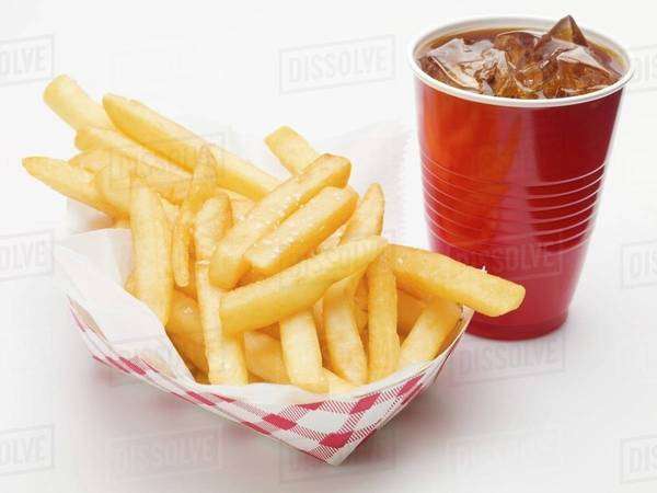 A portion of chips with cola in fast food containers - Royalty-free ...