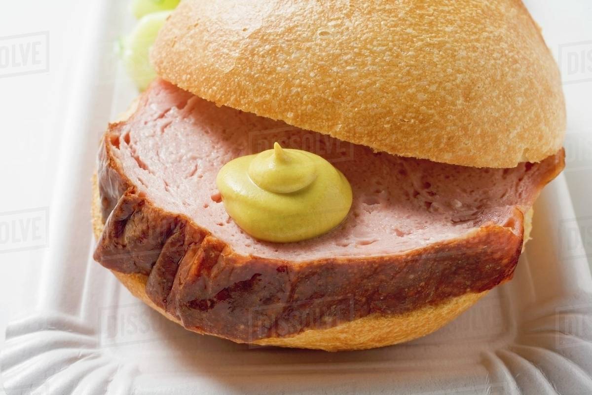 Leberkase (a type of meatloaf) in a bread roll - Royalty-free Stock ...