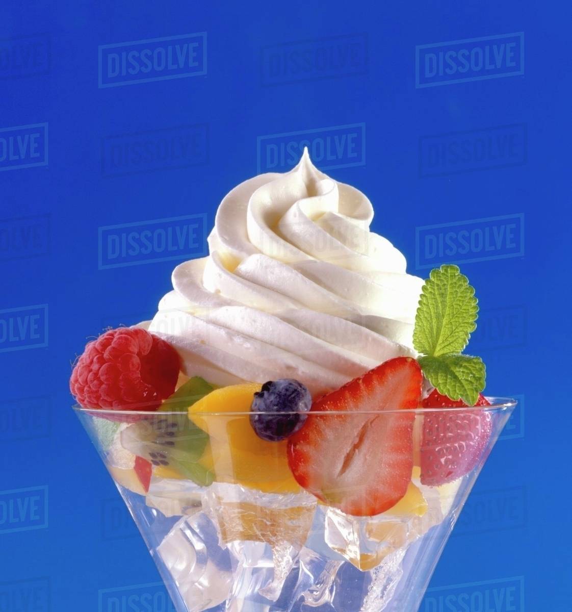 Fruit sundae with cream topping - Royalty-free Stock Photo | Dissolve