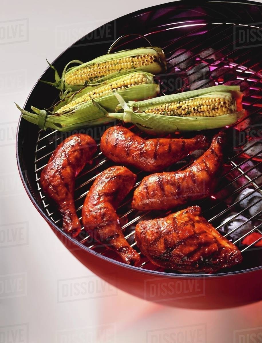 Barbecue Chicken and Corn on the Cob on the Grill - Stock Photo - Dissolve