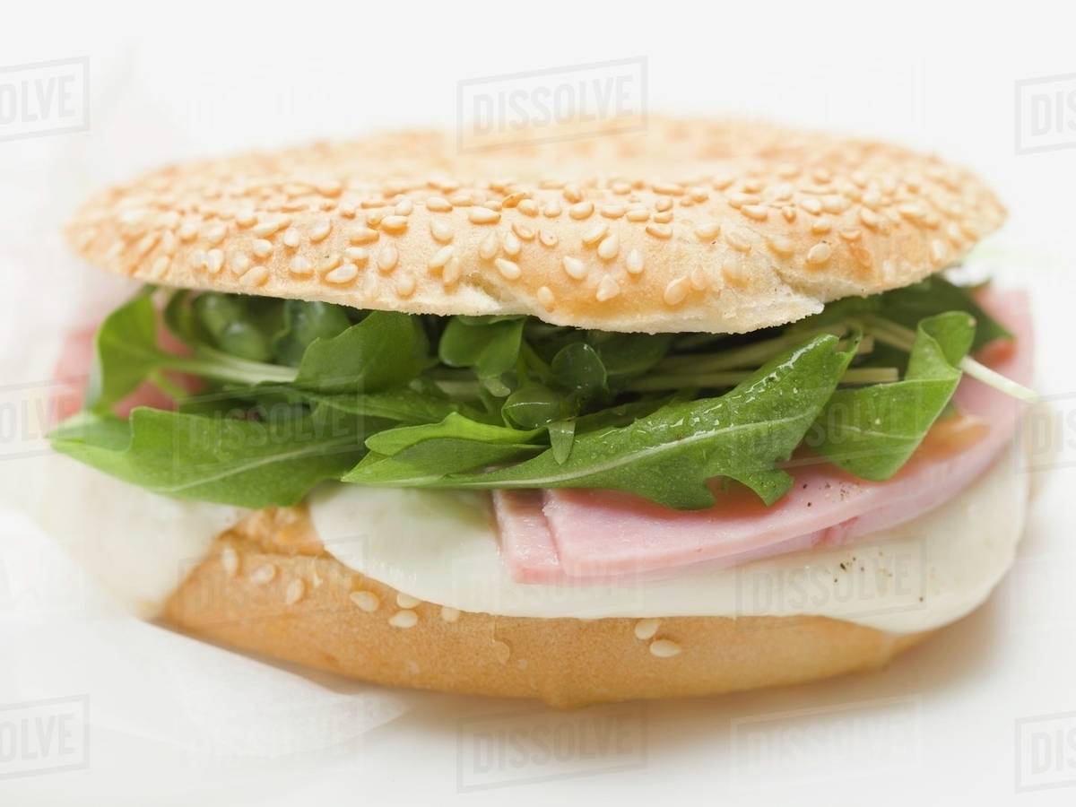Ham, cheese and rocket in sesame bagel - Royalty-free Stock Photo ...