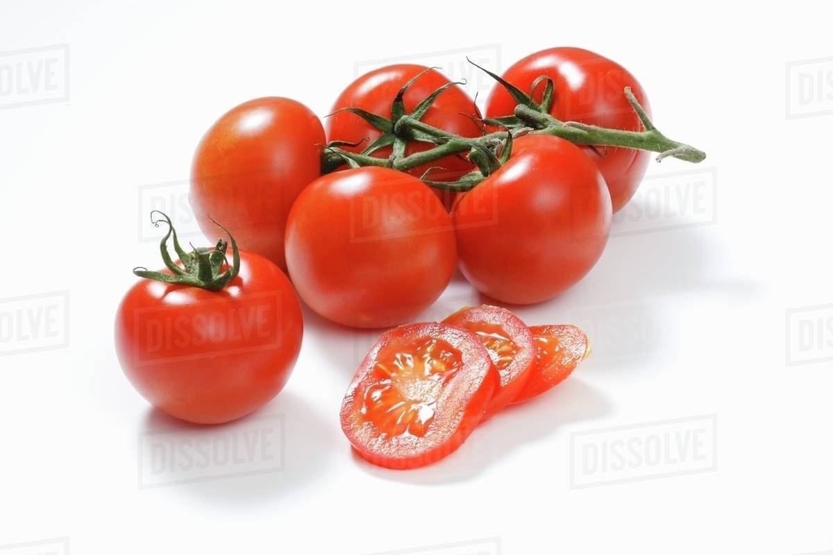 Tomatoes and tomato slices - Royalty-free Stock Photo | Dissolve