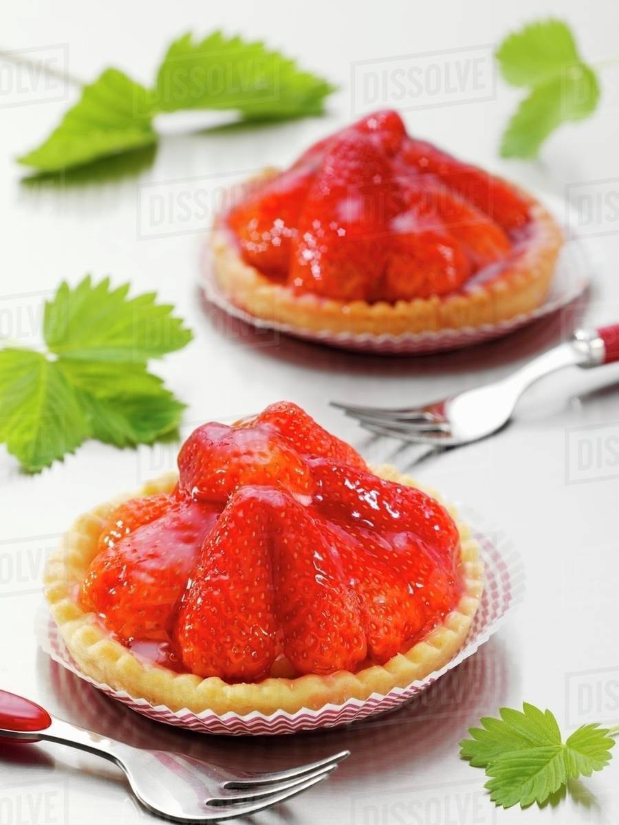 Two strawberry tarts - Stock Photo - Dissolve