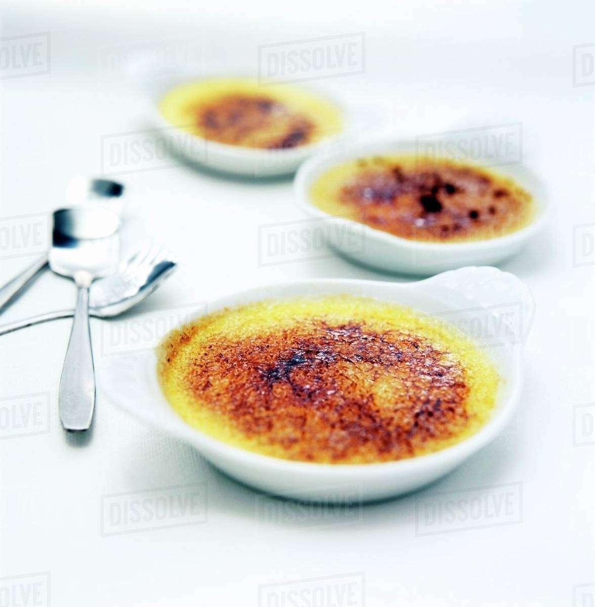 Three dishes with creme brulee - Royalty-free Stock Photo | Dissolve