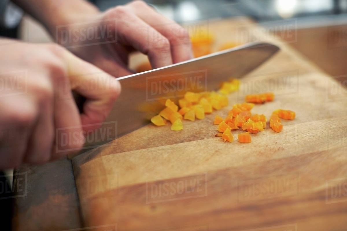 Dicing dried apricots - Royalty-free Stock Photo | Dissolve