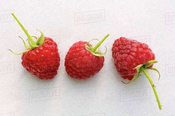 Three raspberries - Royalty-free Stock Photo | Dissolve