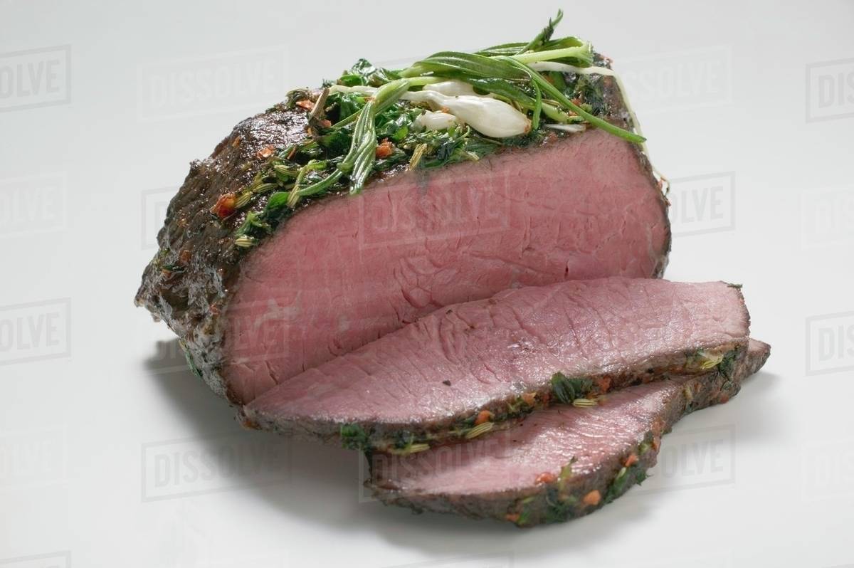 Roast beef, partly carved - Stock Photo - Dissolve