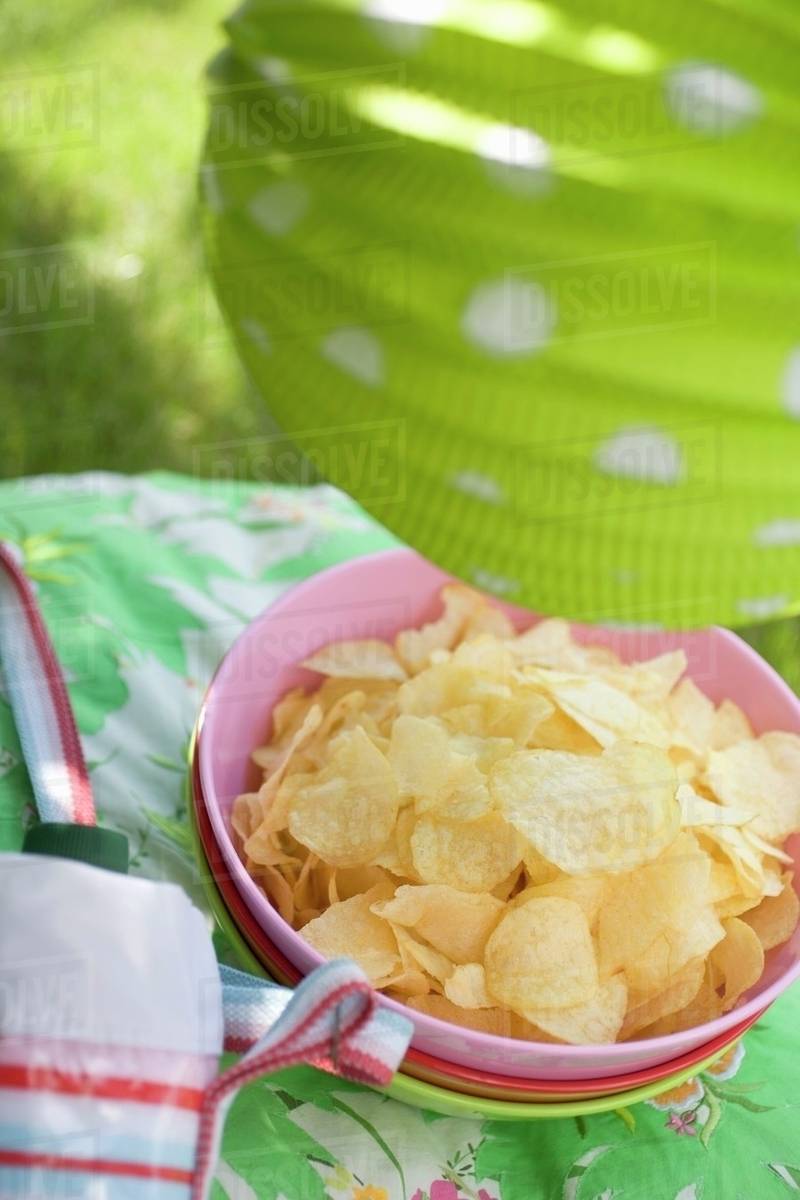 Potato crisps at a garden party - Stock Photo - Dissolve