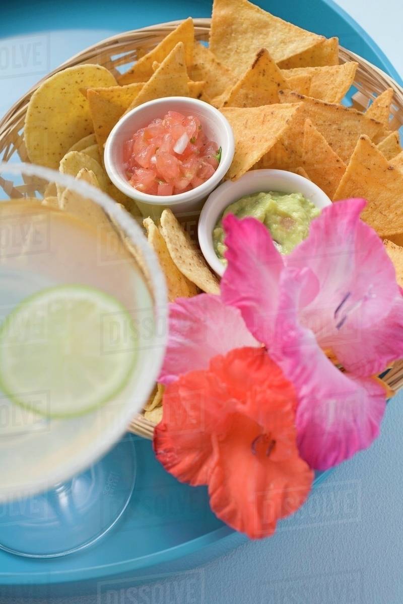 Nachos with two dips and Margarita on tray - Stock Photo - Dissolve
