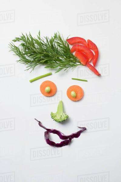 Amusing face made from vegetables and dill - Stock Photo - Dissolve