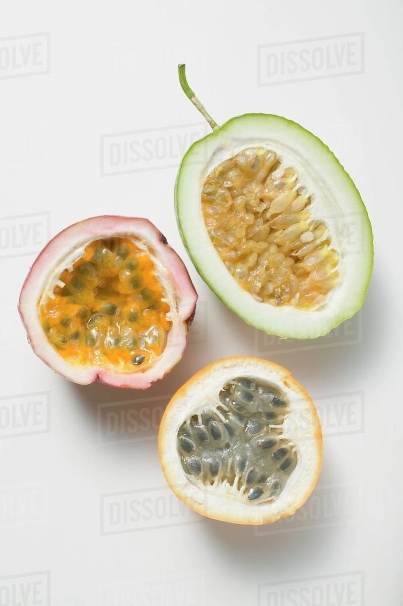 Various types of passion fruit, halved - Stock Photo - Dissolve