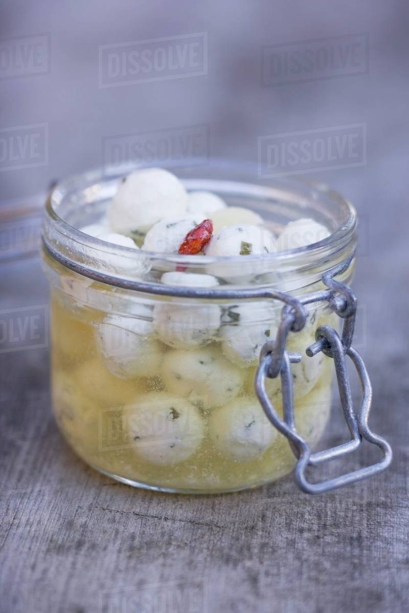 Marinated cheese balls in jar - Royalty-free Stock Photo | Dissolve