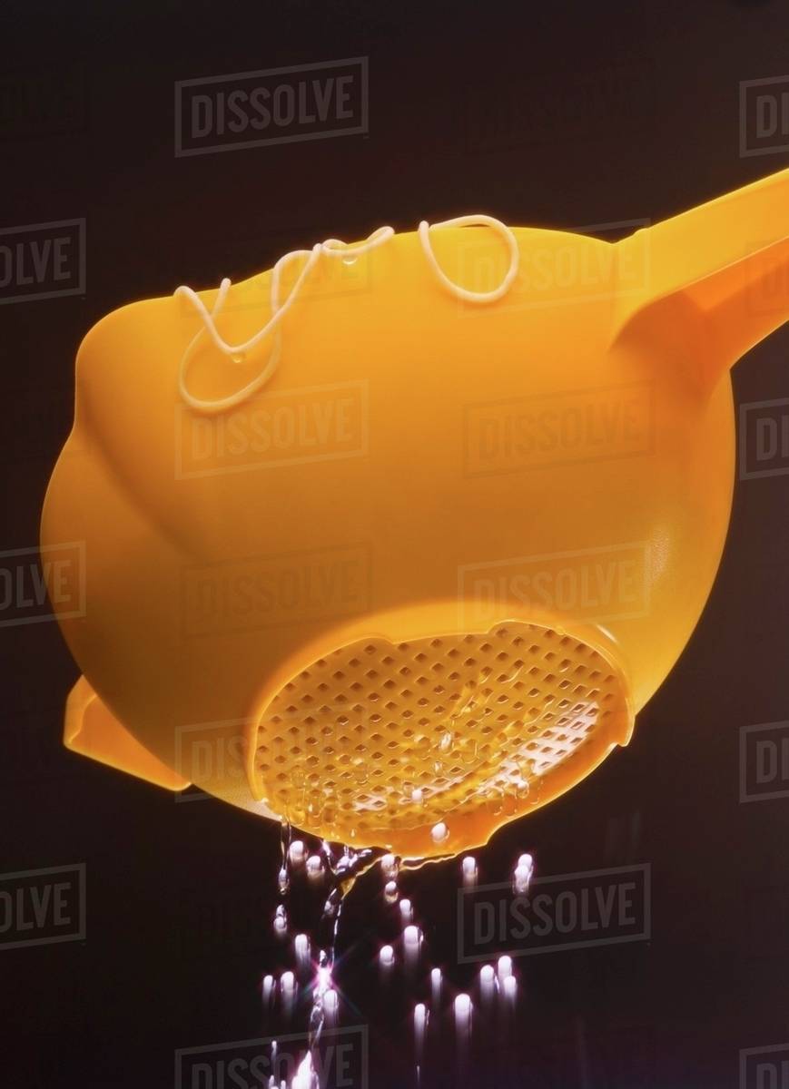 Spaghetti Draining in a Colander - Stock Photo - Dissolve
