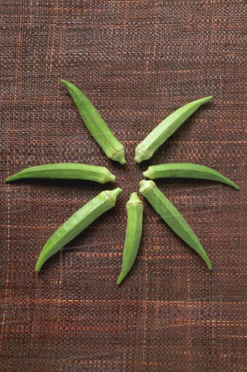 Seven okra pods arranged in a star shape - Royalty-free Stock Photo ...
