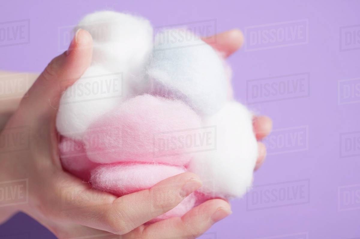 Hands holding cotton wool balls - Royalty-free Stock Photo | Dissolve