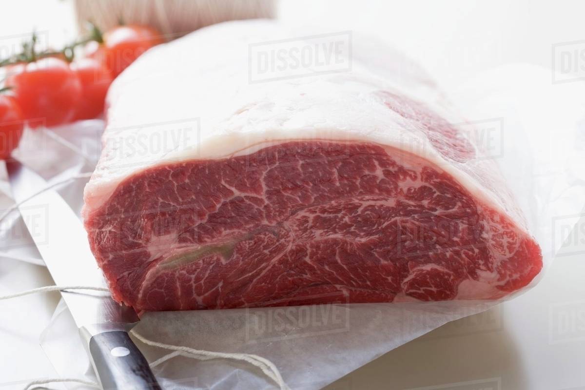 Fresh beef on paper - Stock Photo - Dissolve