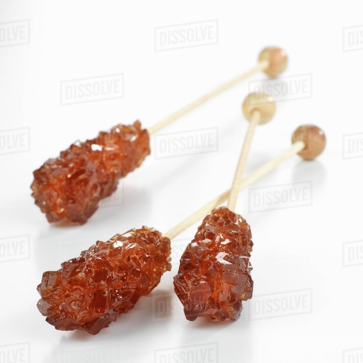 Three sugar swizzle sticks - Royalty-free Stock Photo | Dissolve