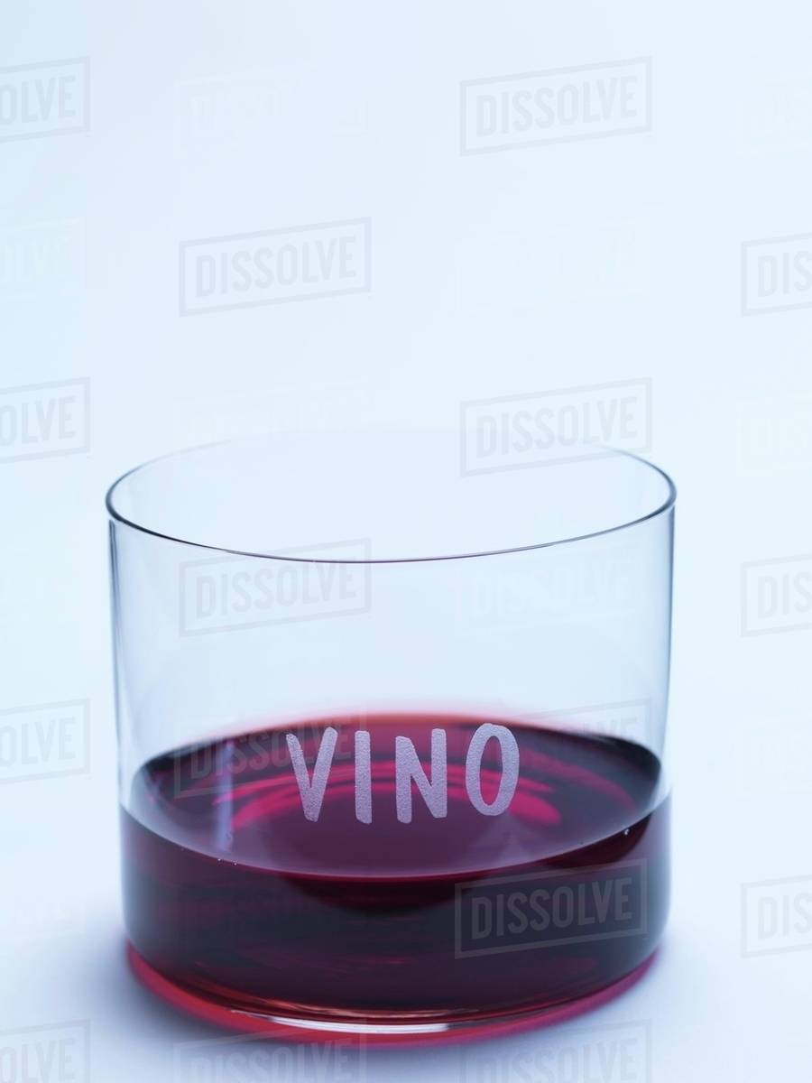 Glass of red wine with the word VINO - Royalty-free Stock Photo | Dissolve