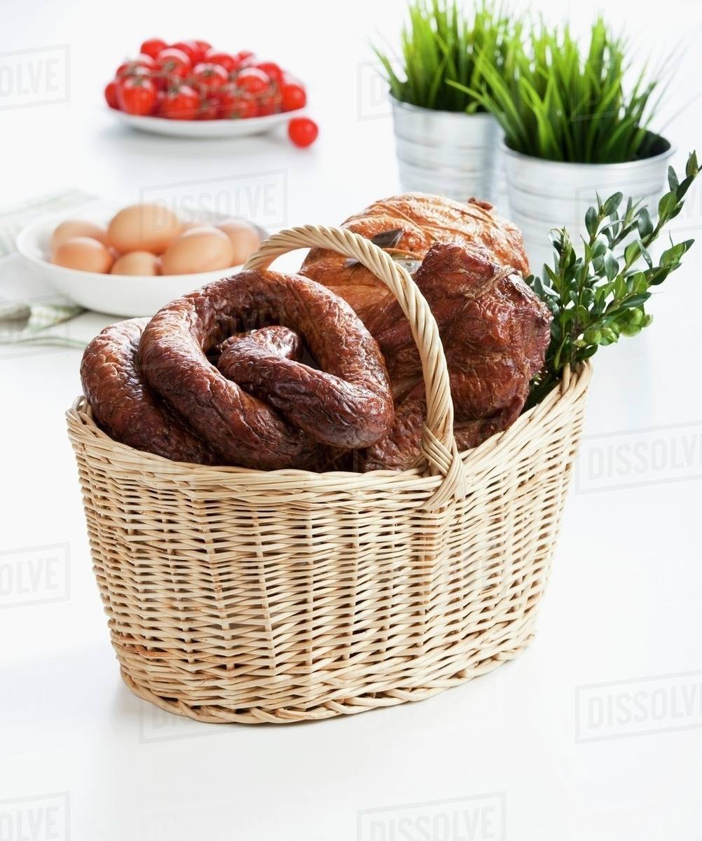 Various sausages and ham in an Easter basket - Royalty-free Stock Photo ...