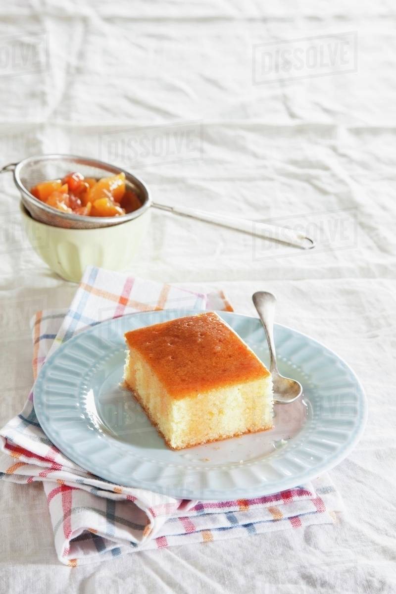A slice of semolina cake with summer fruit syrup - Royalty-free Stock ...