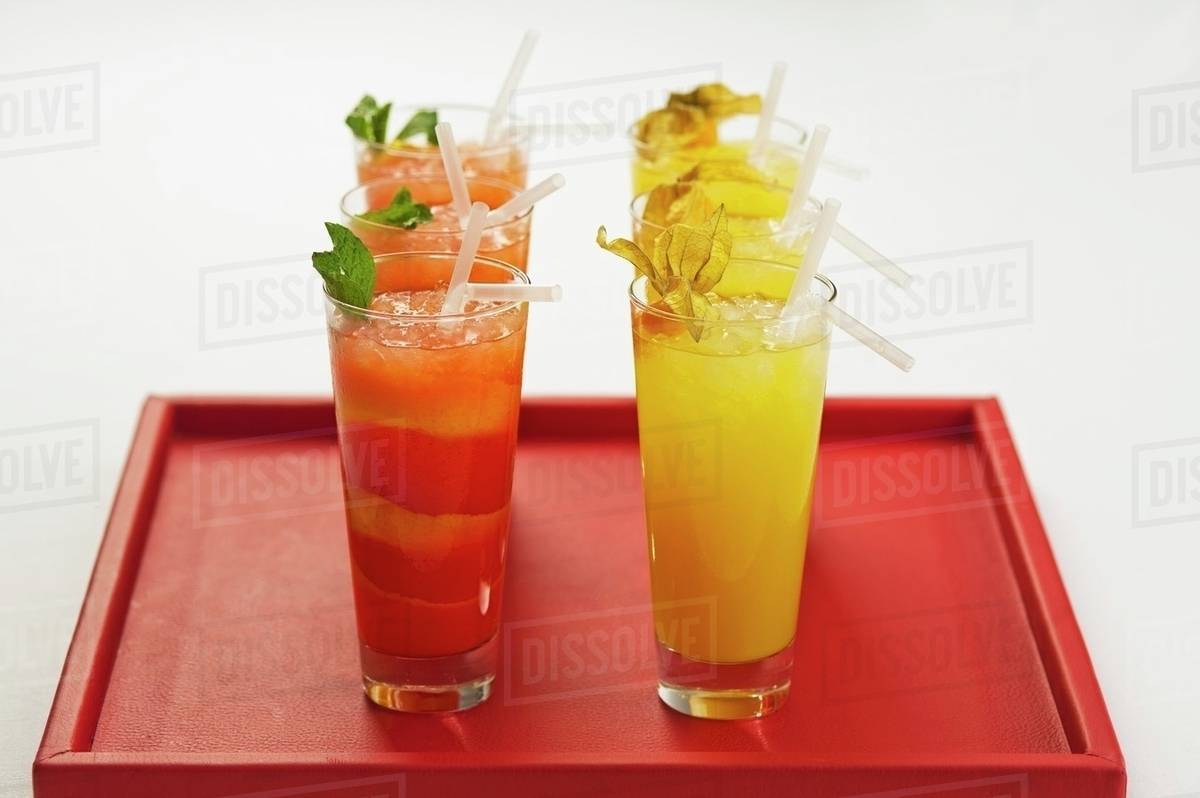 Red and yellow fruit cocktails - Royalty-free Stock Photo | Dissolve