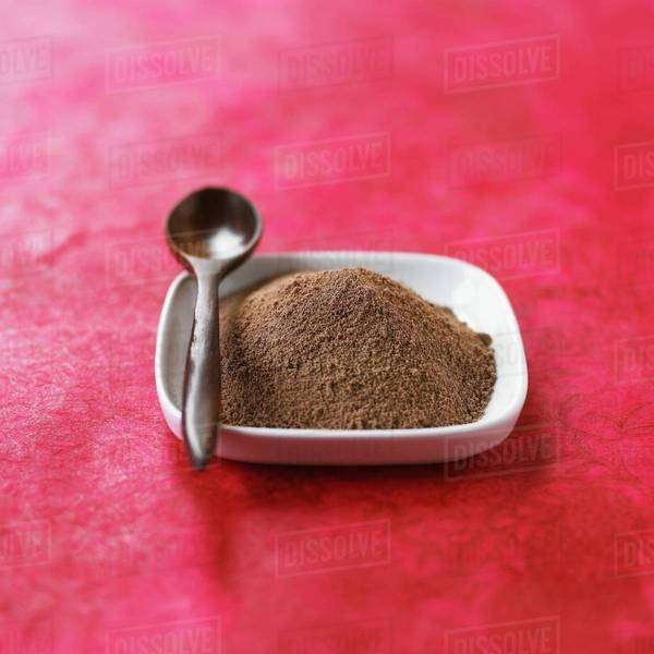 A pile of chocolate powder - Stock Photo - Dissolve