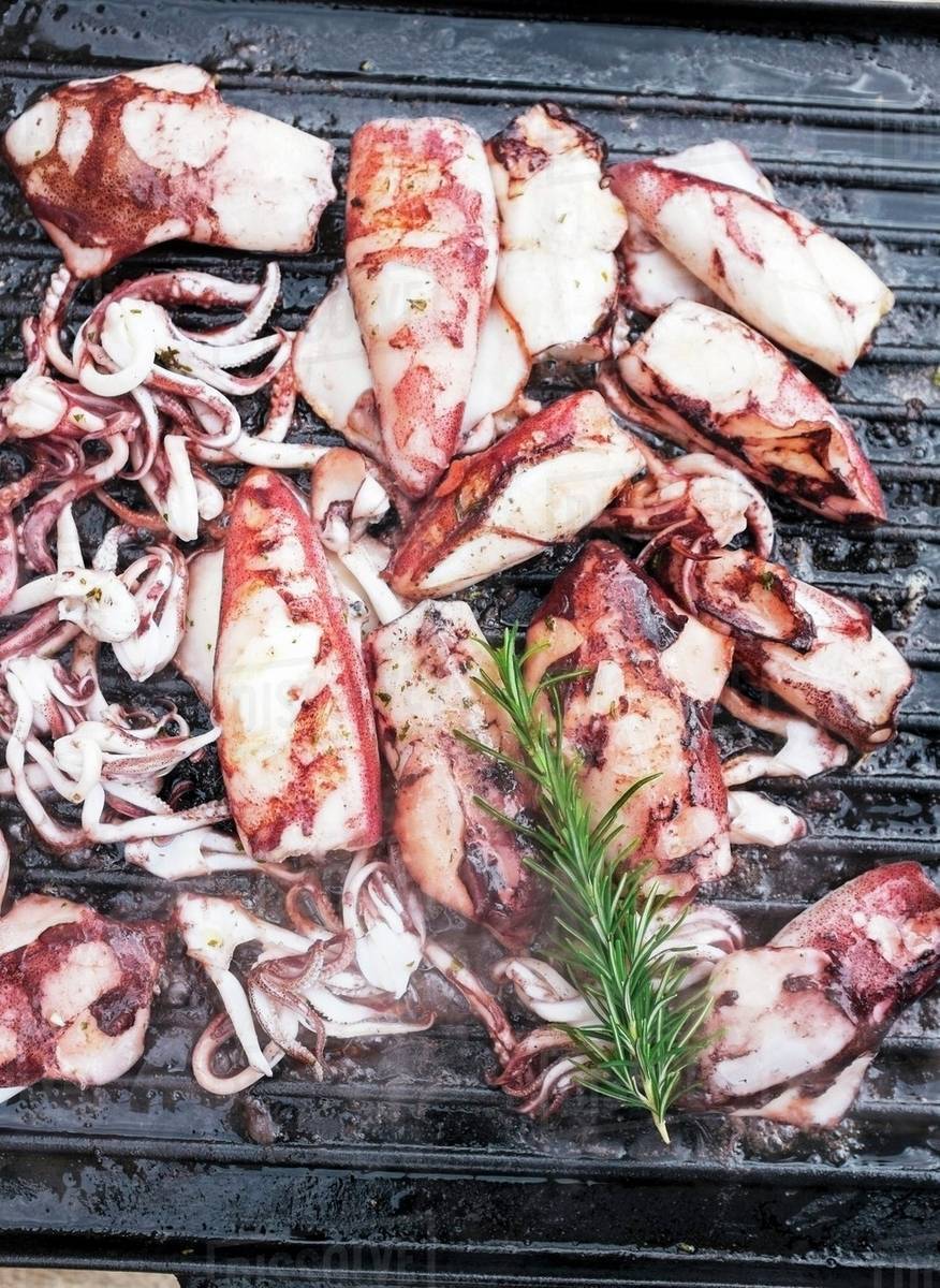 Squid on a barbecue - Royalty-free Stock Photo | Dissolve