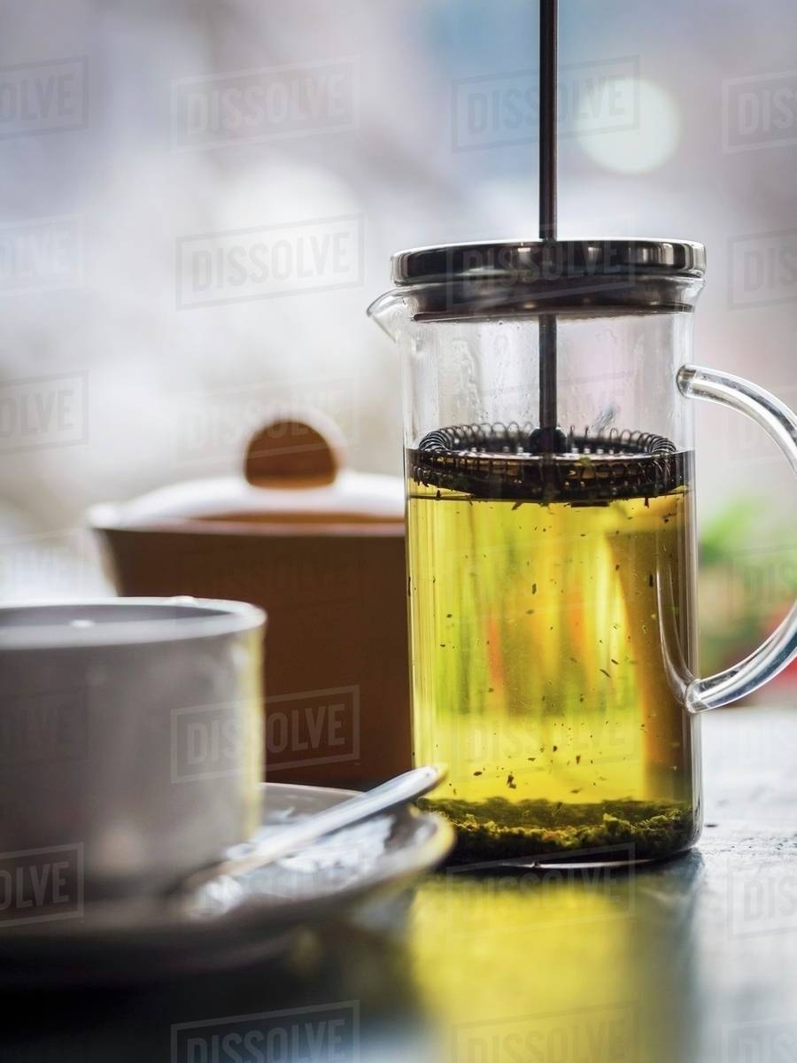 Green jasmine tea in a cup and in a tea press - Royalty-free Stock ...