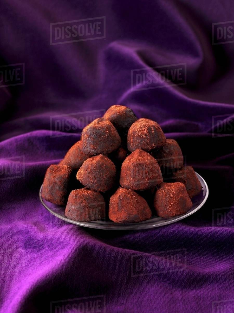 Dark chocolate truffles on a plate - Royalty-free Stock Photo | Dissolve