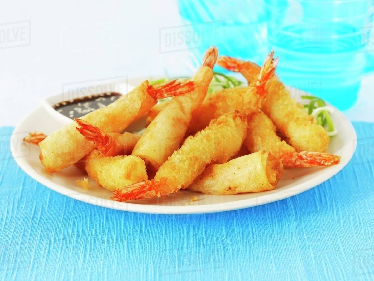 Breaded prawns and prawns wrapped in puff pastry - Stock Photo - Dissolve